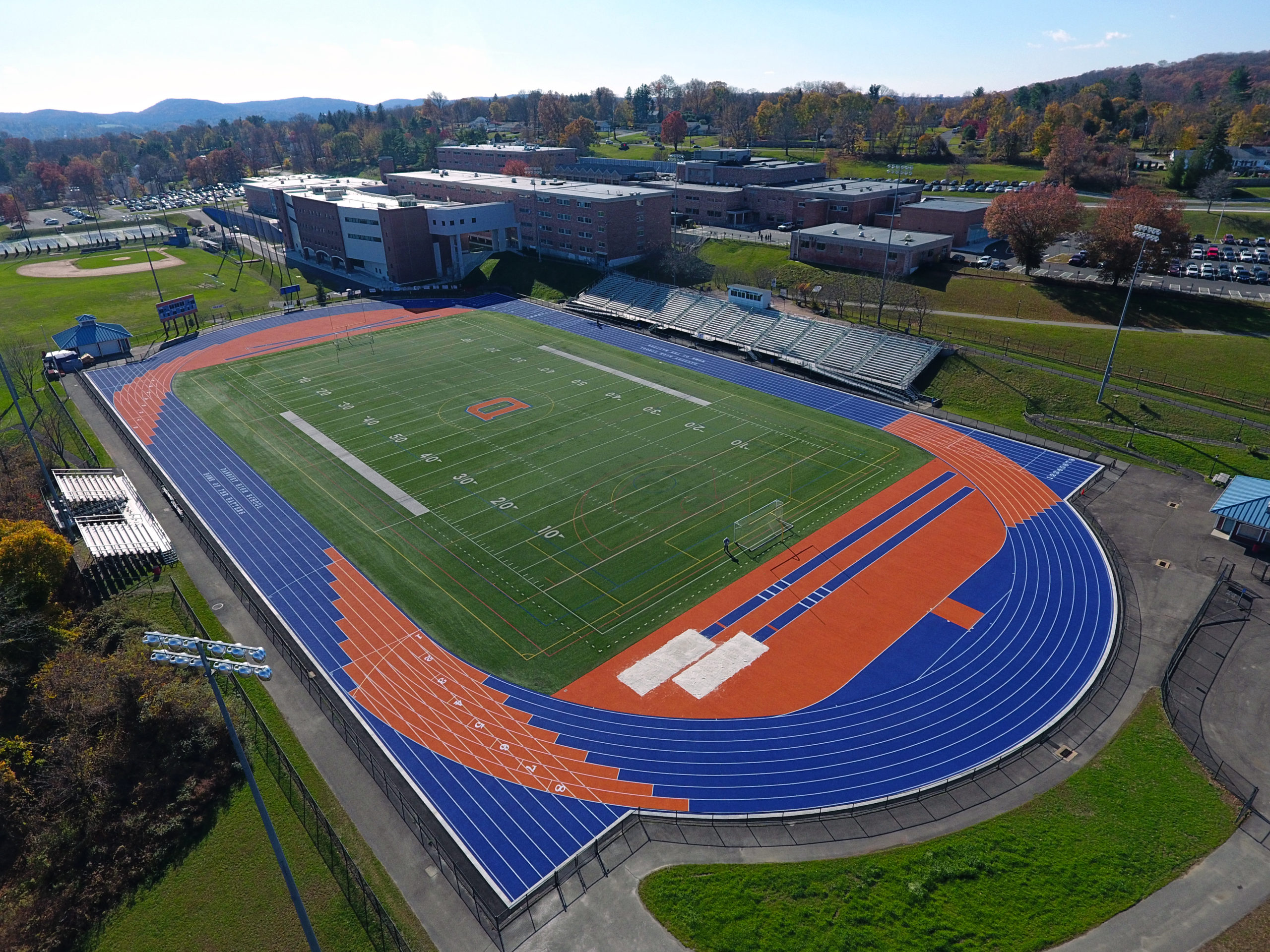 ATT Sports Inc | Examples of blue running tracks